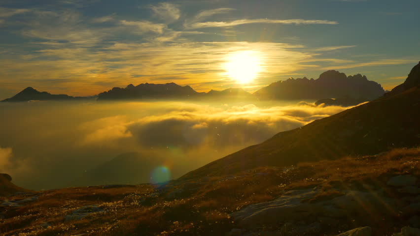 AERIAL: Sunset Above The Clouds On Top Of The Mountain Stock Footage ...