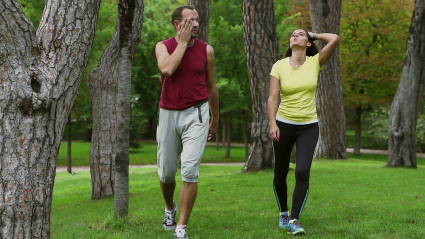 Tired Joggers After Run Walking In The Park, Slow Motion Shot At 240fps ...
