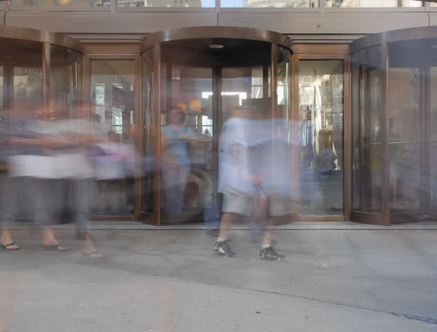 People Spinning In And Out Revolving Door Time Lapse Stock Footage ...