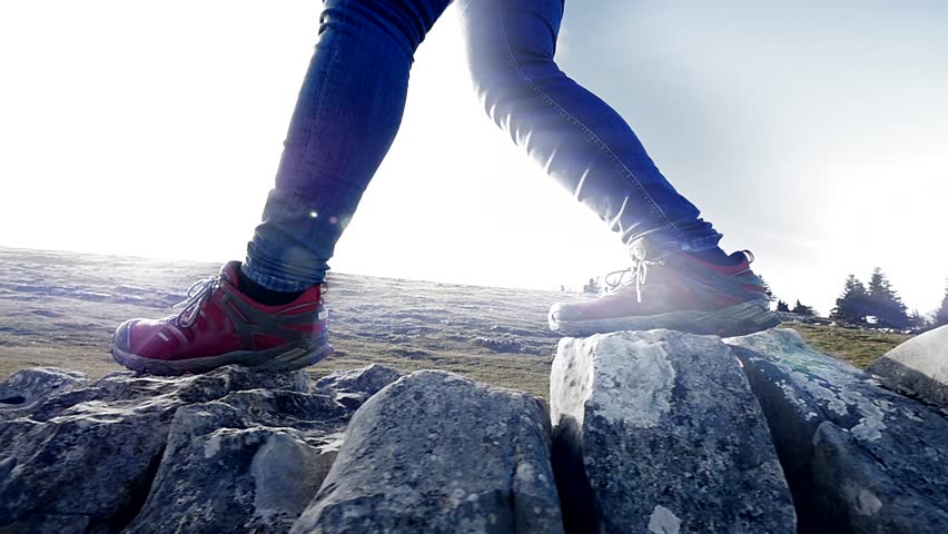Female Hiker Walking On Rough Terrain. Foot Steps In Slow Motion ...