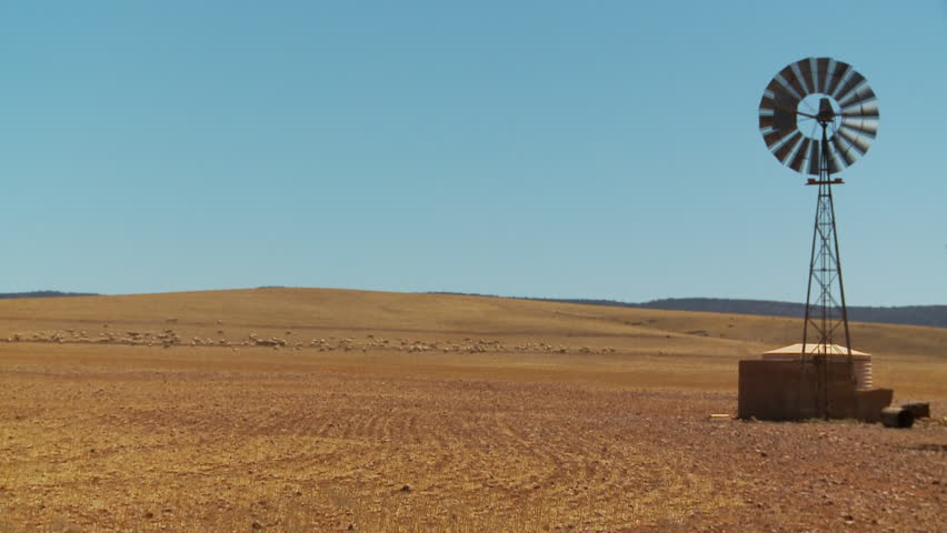 Spinning Water Pumping Windmill In Dry / Arid Area - Motionphoto ...