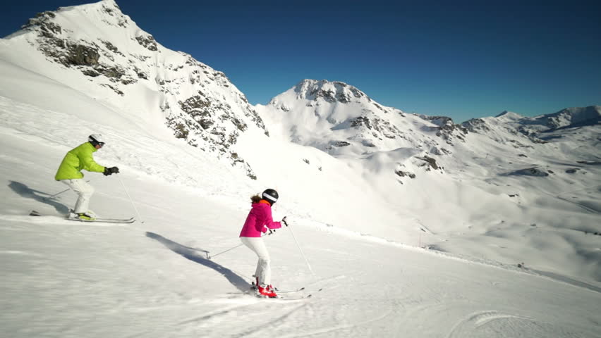 Stock video of couple skiing on ski piste side | 8857807 | Shutterstock
