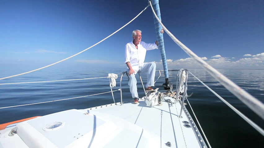 Healthy Retired Couple Enjoying Leisure Aboard Their Luxury Sailing ...
